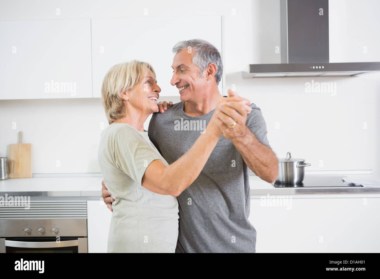 Smiling couple dancing together Stock Photo - Alamy