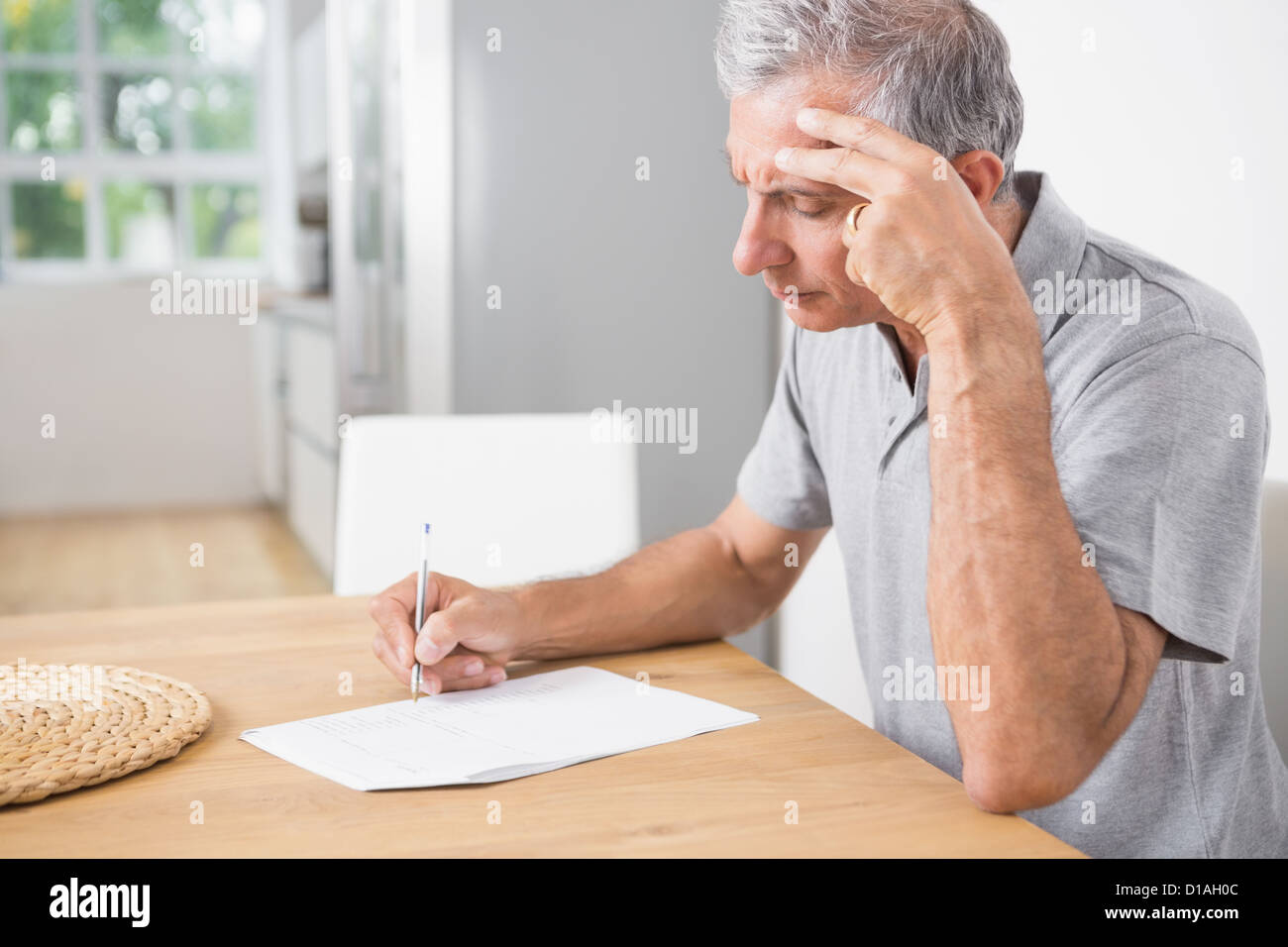 Man reading documents Stock Photo - Alamy