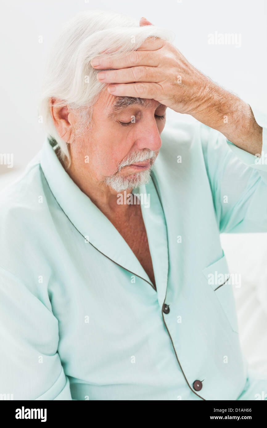 Man checking his temperature Stock Photo - Alamy