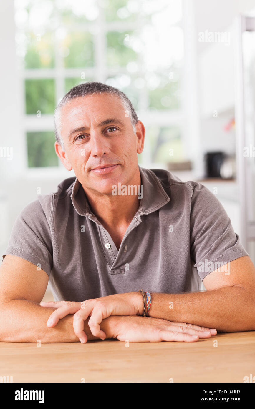 Man smiling in kitchen Stock Photo - Alamy