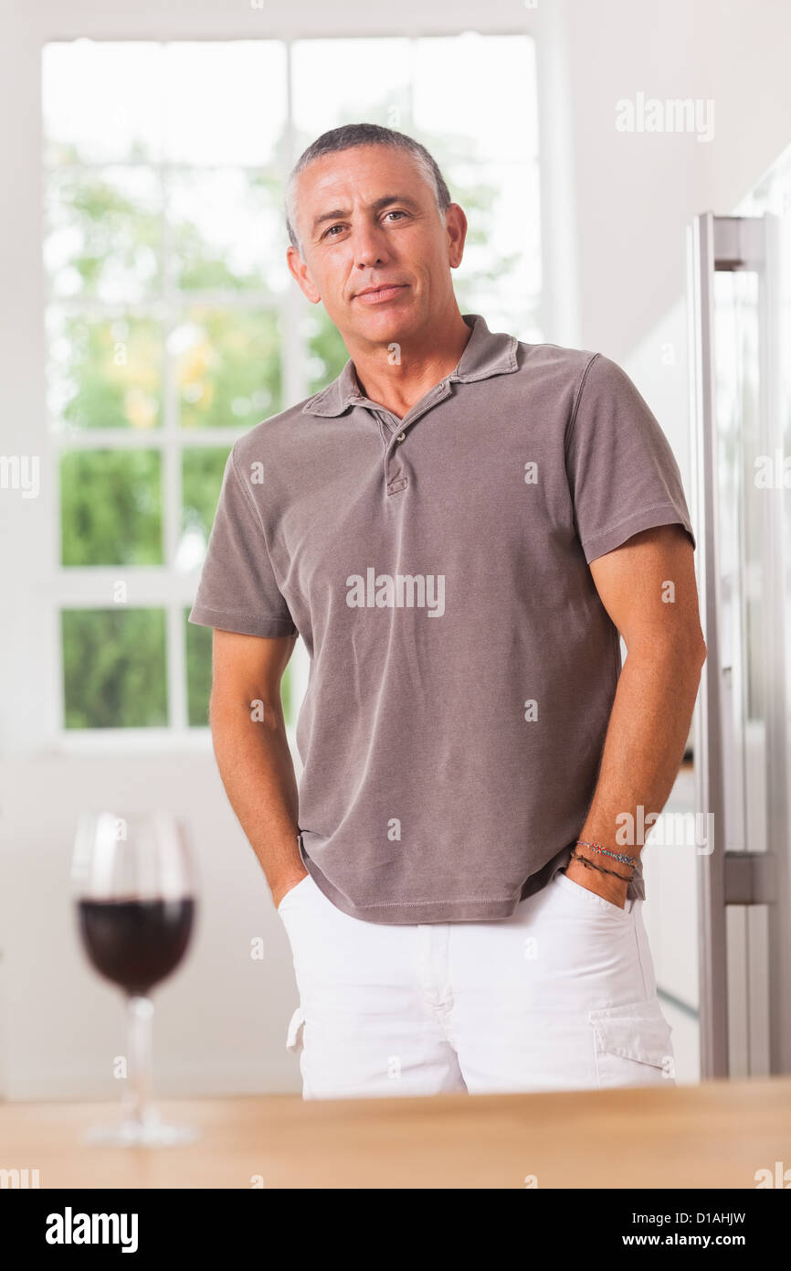 Man standing in kitchen Stock Photo - Alamy