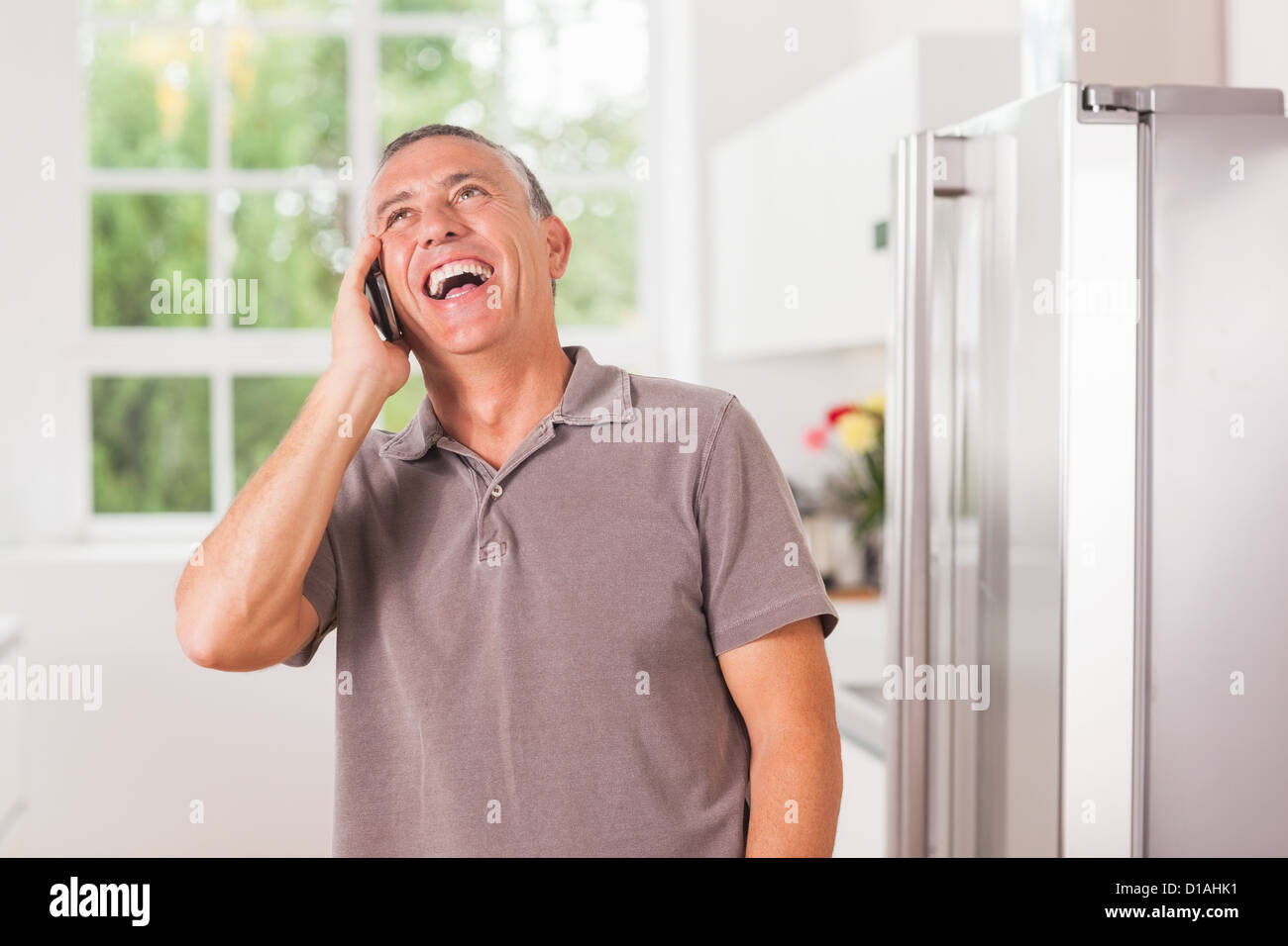 Happy man talking on phone Stock Photo - Alamy