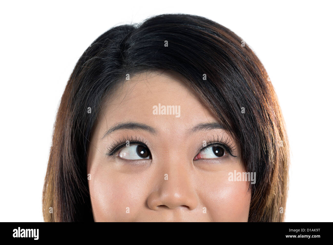 Closeup of beautiful Chinese woman looking up. Isolated on white ...