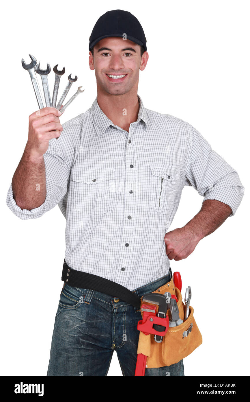 Mechanic with spanners Stock Photo - Alamy