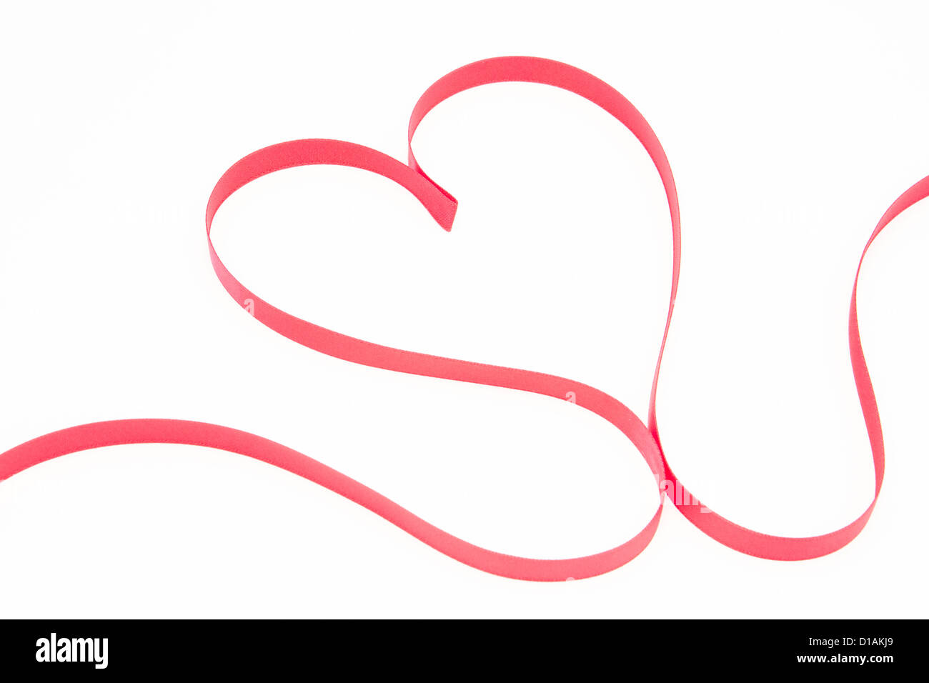 Pink ribbon shaped into heart Stock Photo - Alamy