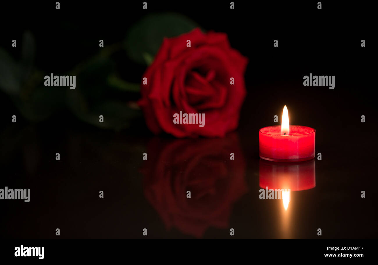 Romantic candle with red rose Stock Photo - Alamy