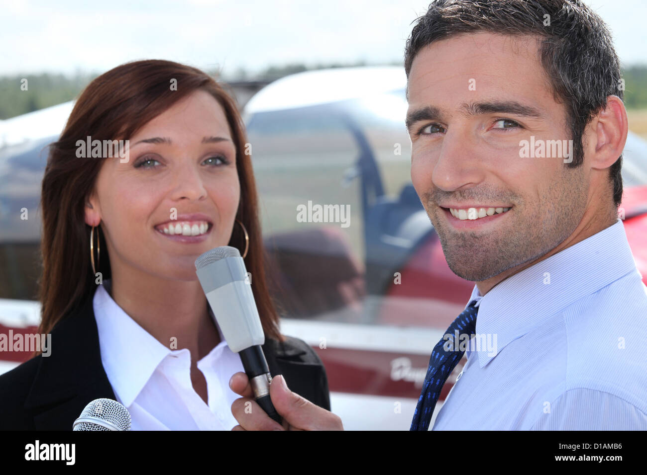 Reporter interviewing young man Stock Photo - Alamy
