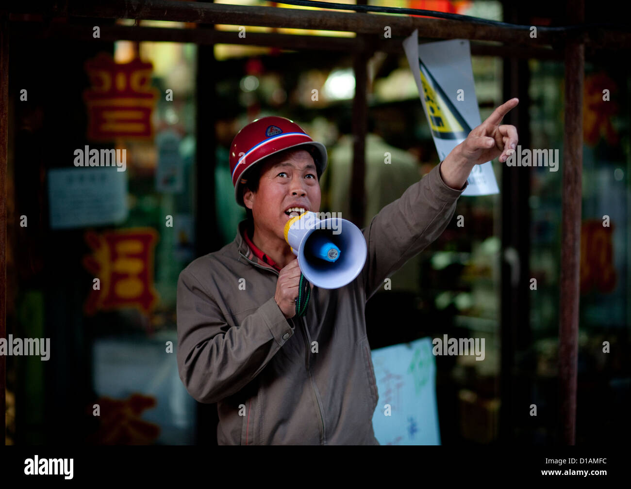Seller Shouting In A Loudspeaker, Beijing China Stock Photo - Alamy