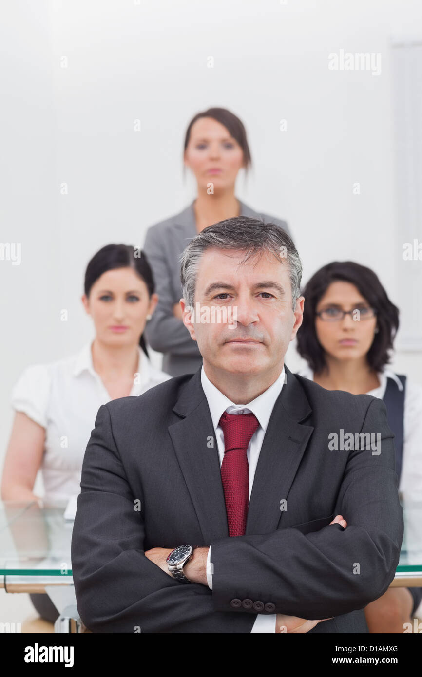 Businessman and his team taking a break Stock Photo - Alamy