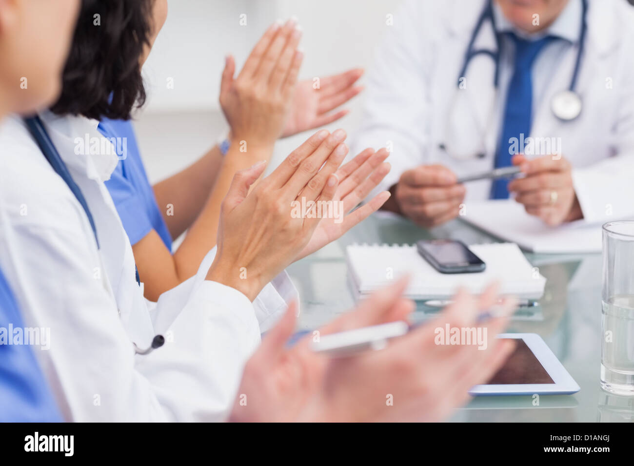 Nurses clapping a doctor Stock Photo - Alamy