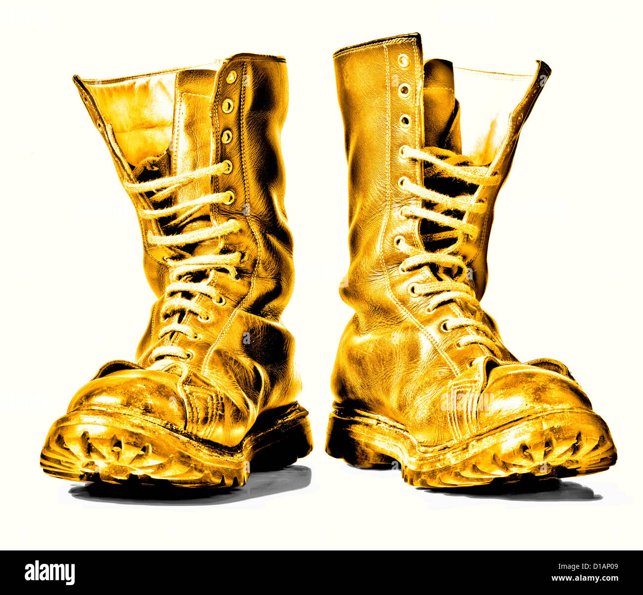 golden combat boots isolated on white background Stock Photo - Alamy