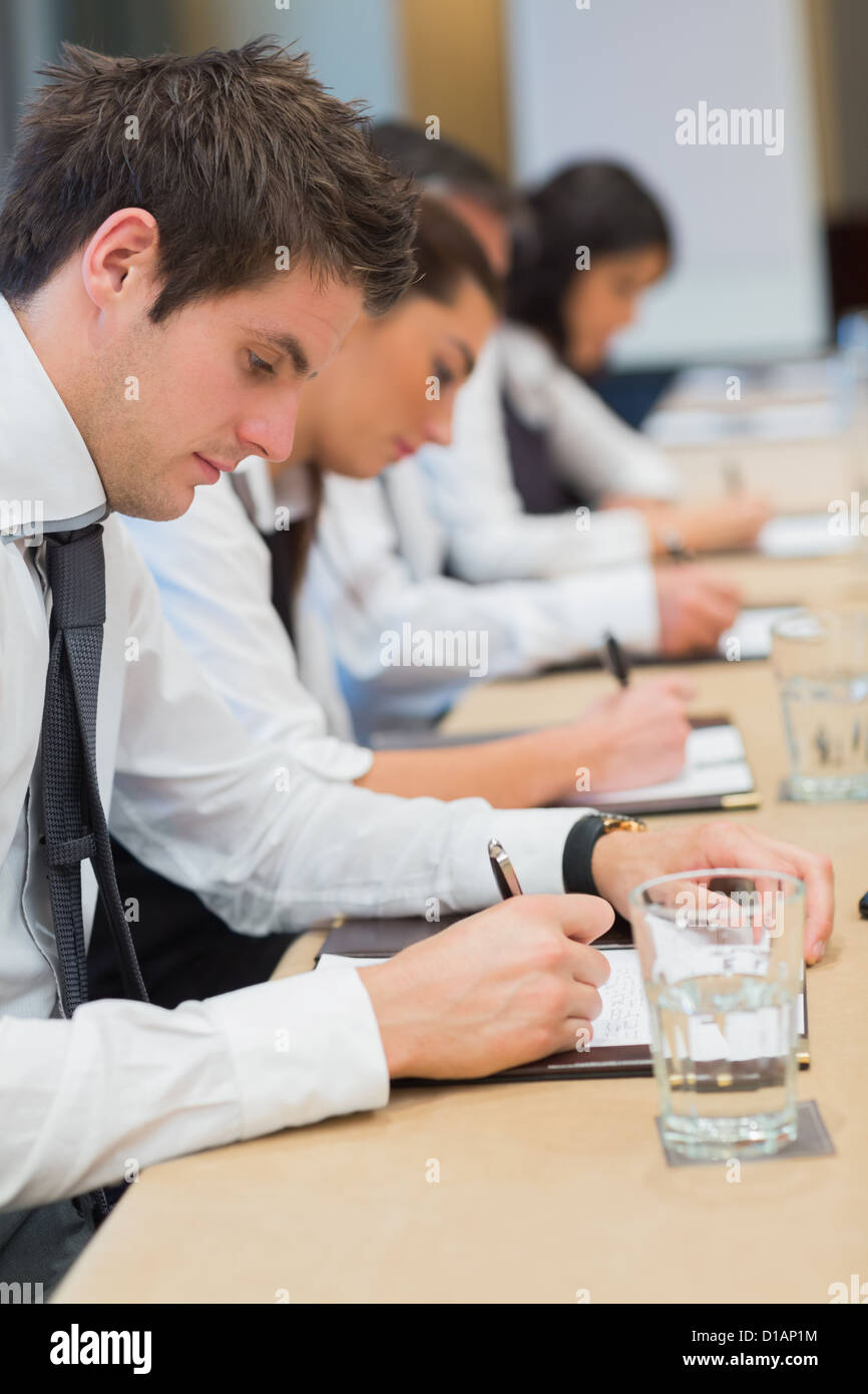 Businessman taking notes Stock Photo - Alamy