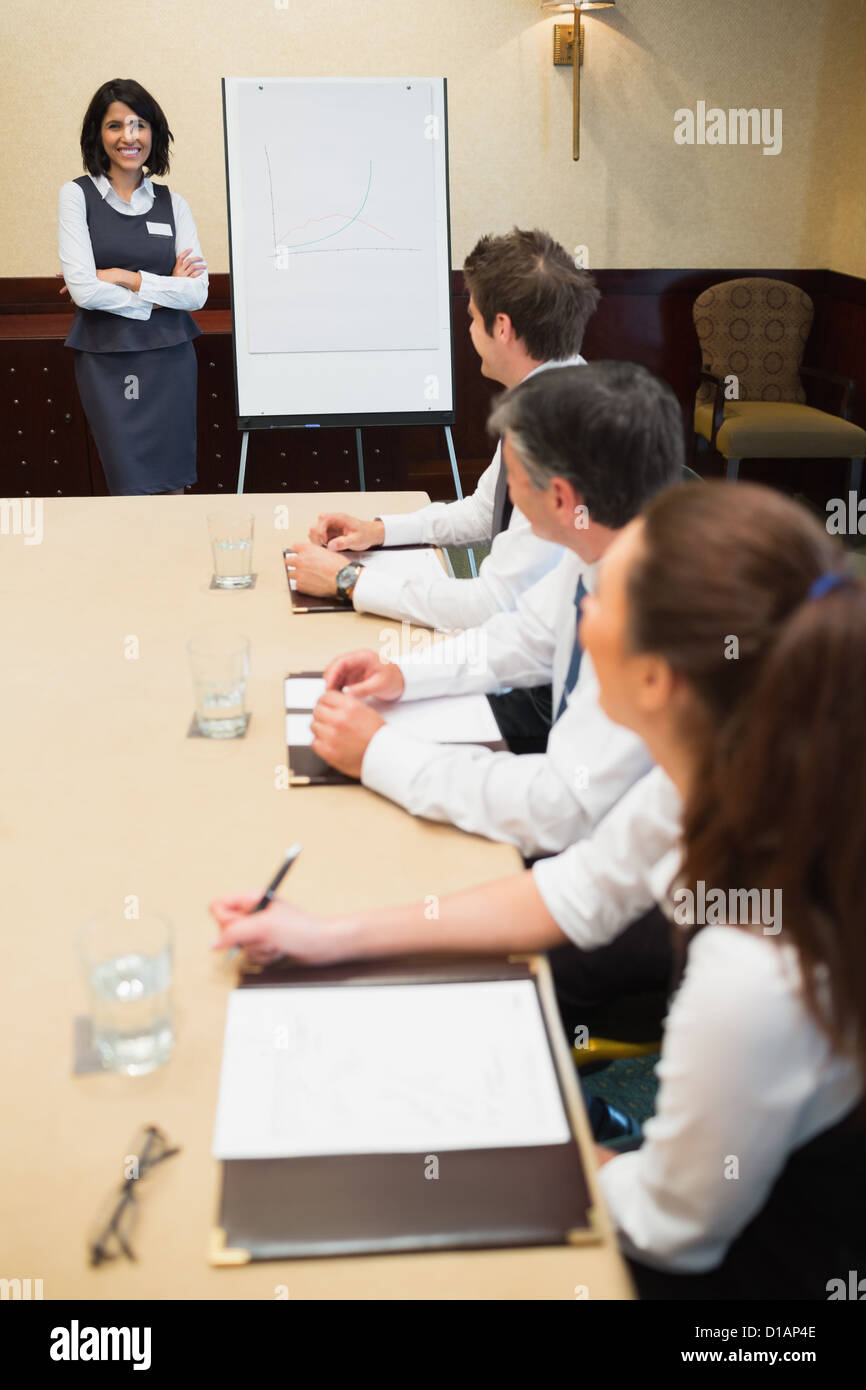Smiling speaker at conference Stock Photo - Alamy