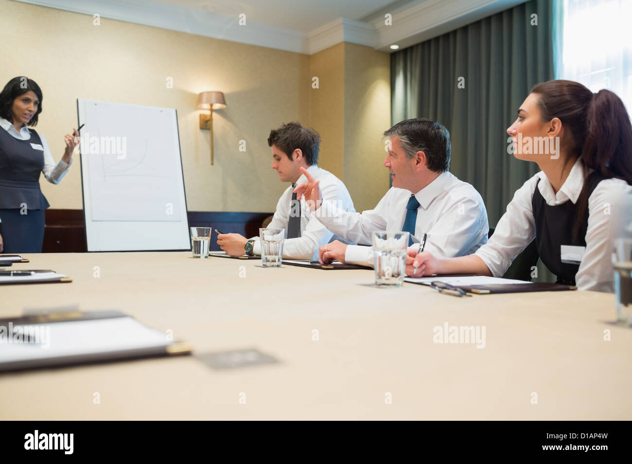 Businessman asking question at presentation Stock Photo - Alamy