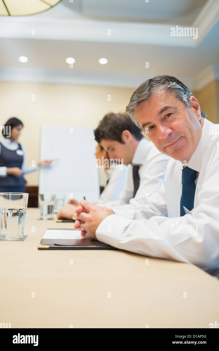 Happy businessman at presentation Stock Photo - Alamy