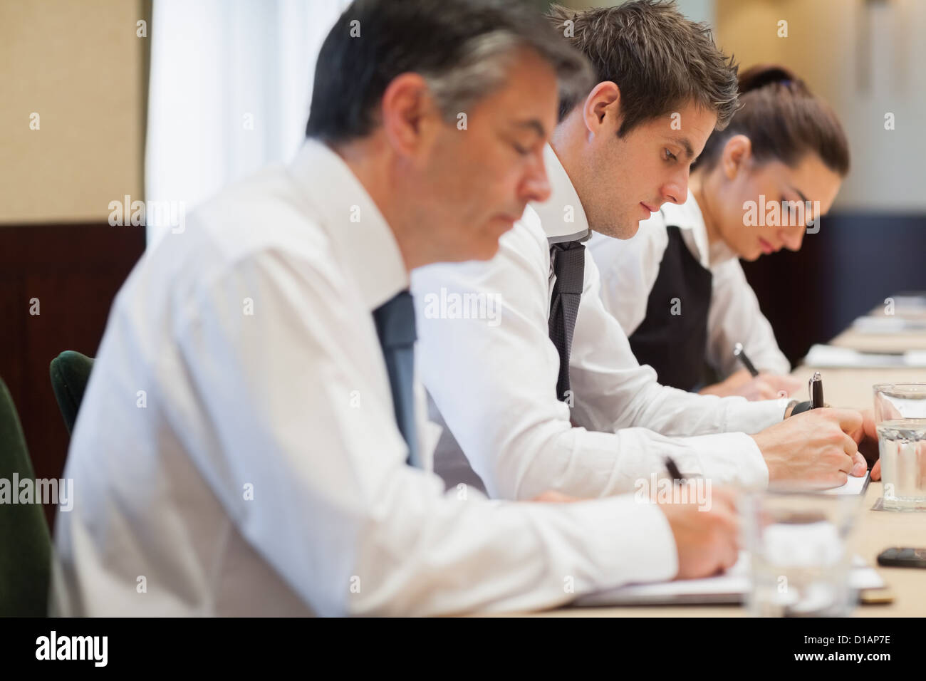 Note taking business people Stock Photo - Alamy