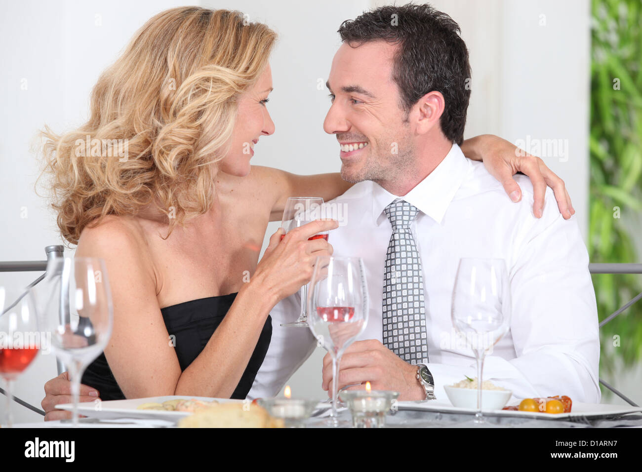 couple at table Stock Photo - Alamy
