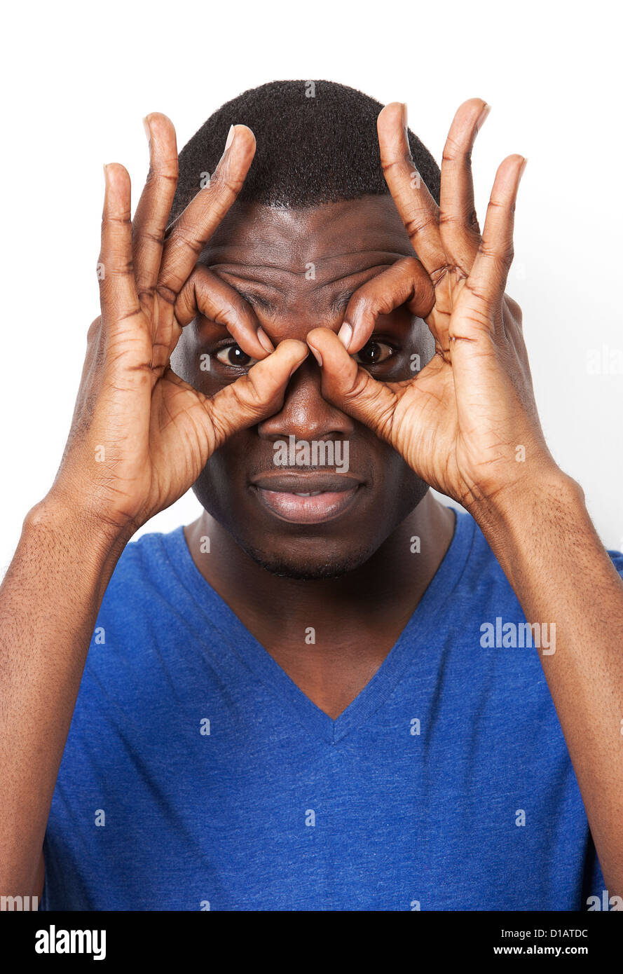 Portrait playful young man hands over eyes Stock Photo - Alamy