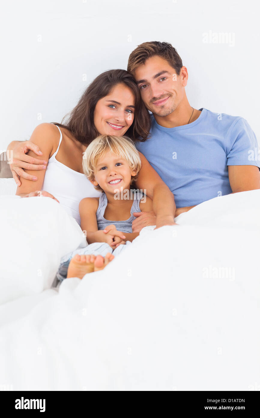Lovely family embracing Stock Photo - Alamy