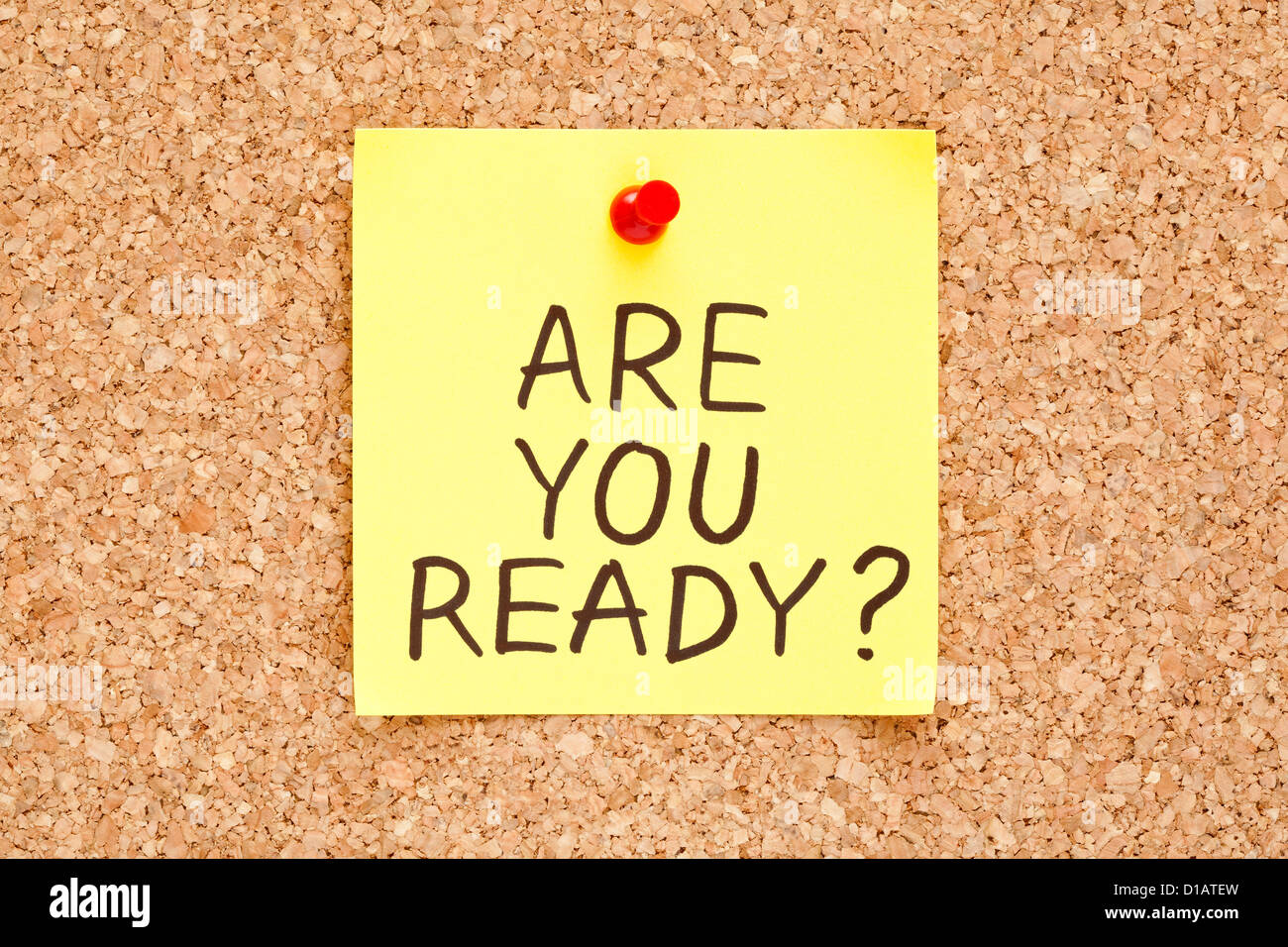 Are You Ready, written on an yellow sticky note on a cork bulletin ...
