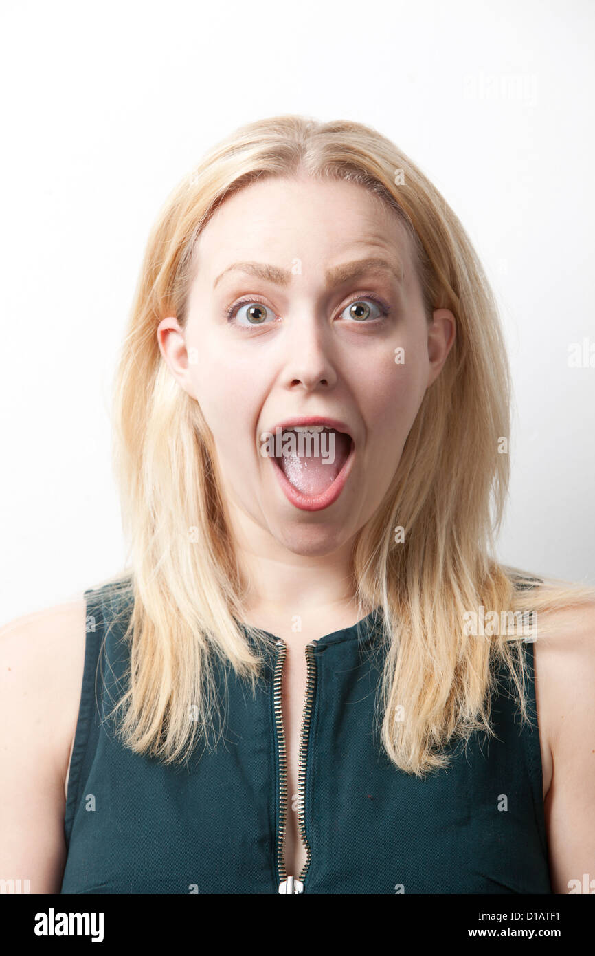 Portrait shocked young woman screaming Stock Photo - Alamy