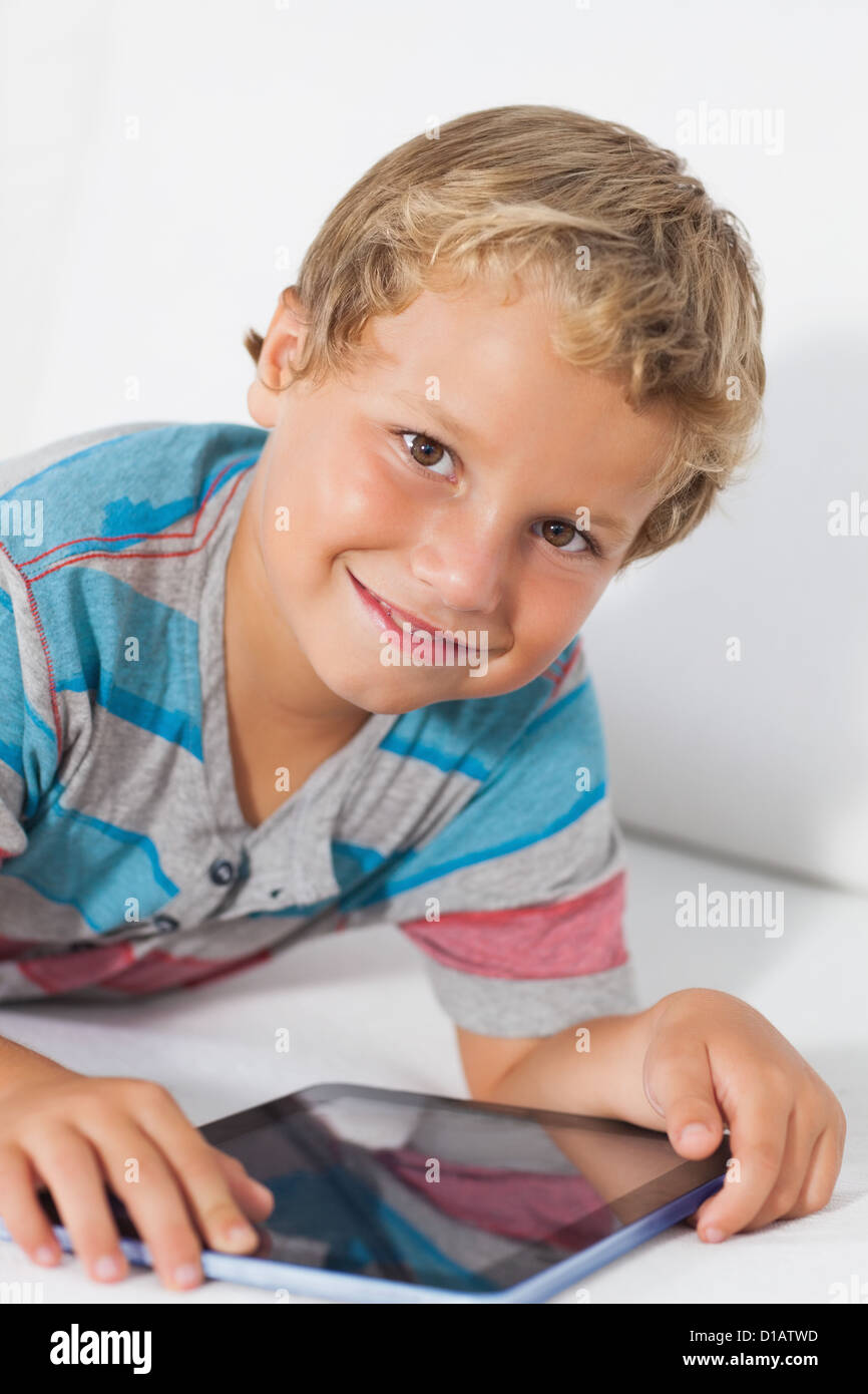 Smiling boy using a tablet Stock Photo - Alamy
