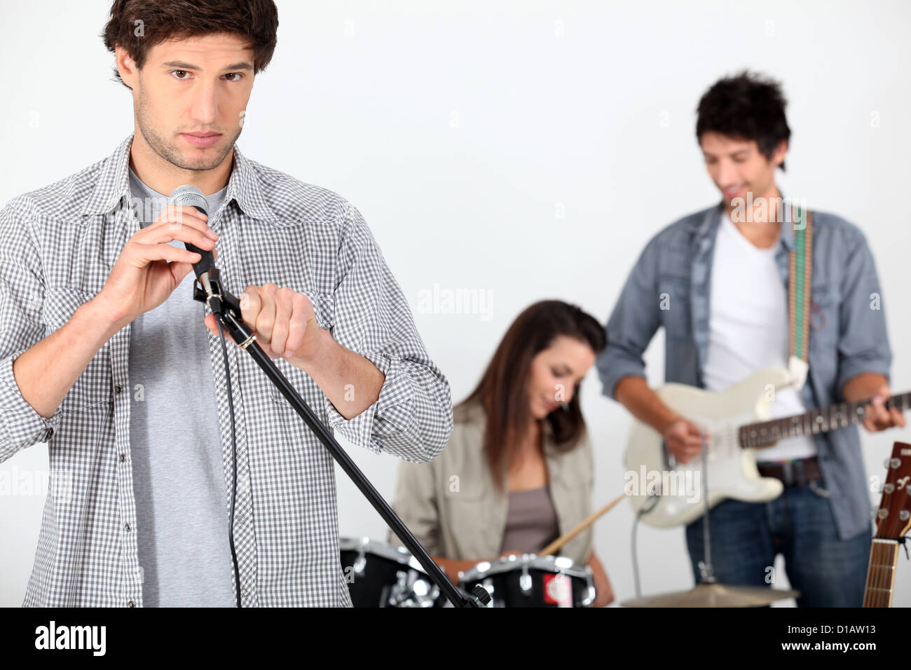Three musicians rehearsing Stock Photo - Alamy