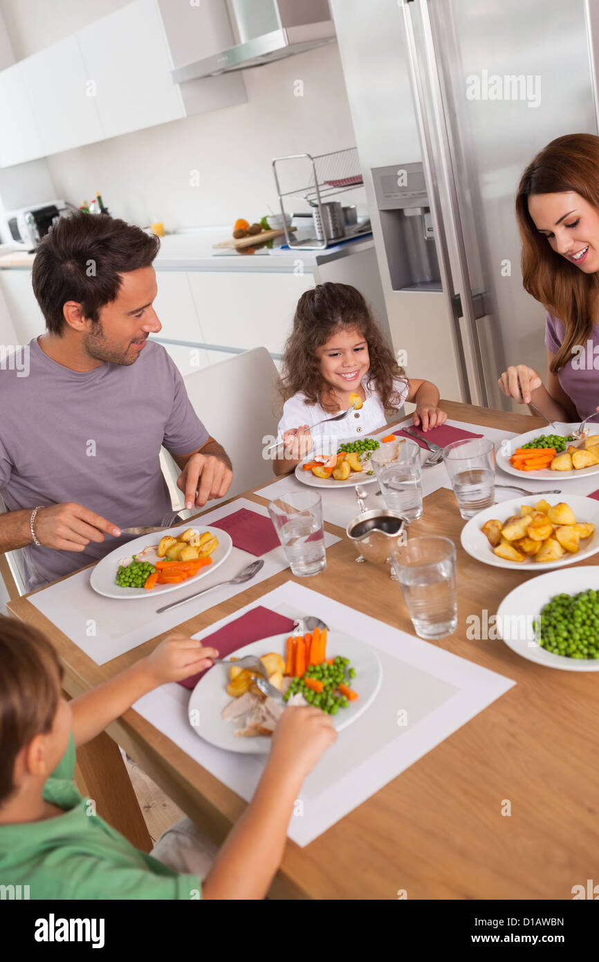 Family eating healthy dinner Stock Photo - Alamy