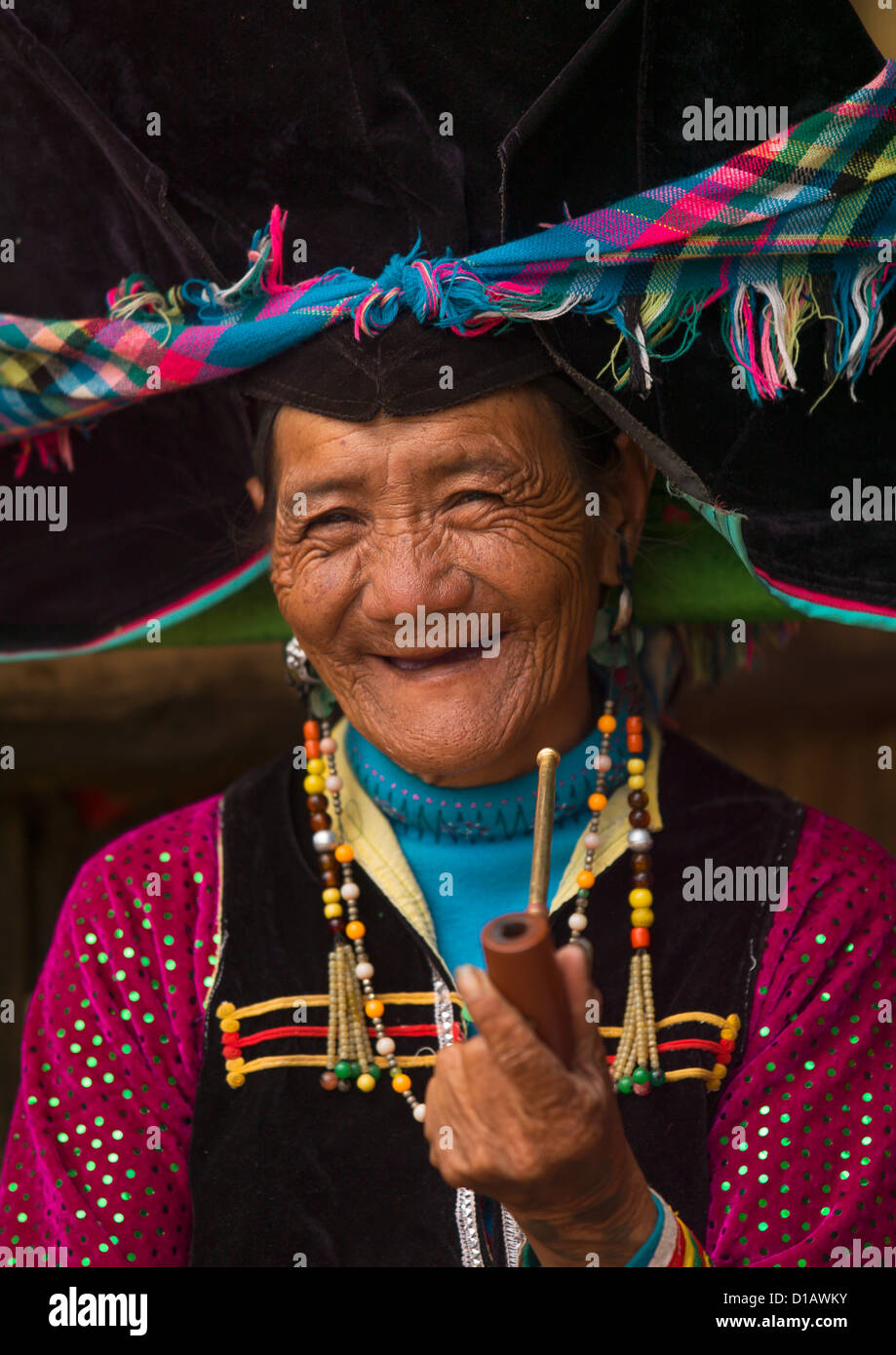Yi Tribal Woman In Traditional Clothes, Yongsheng, Yunnan Province ...