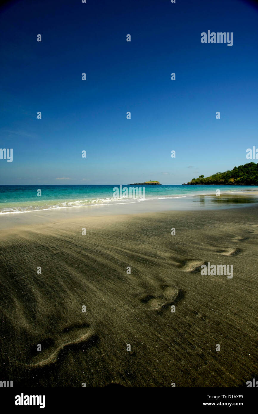 Black and white sand beach in Bali Stock Photo - Alamy