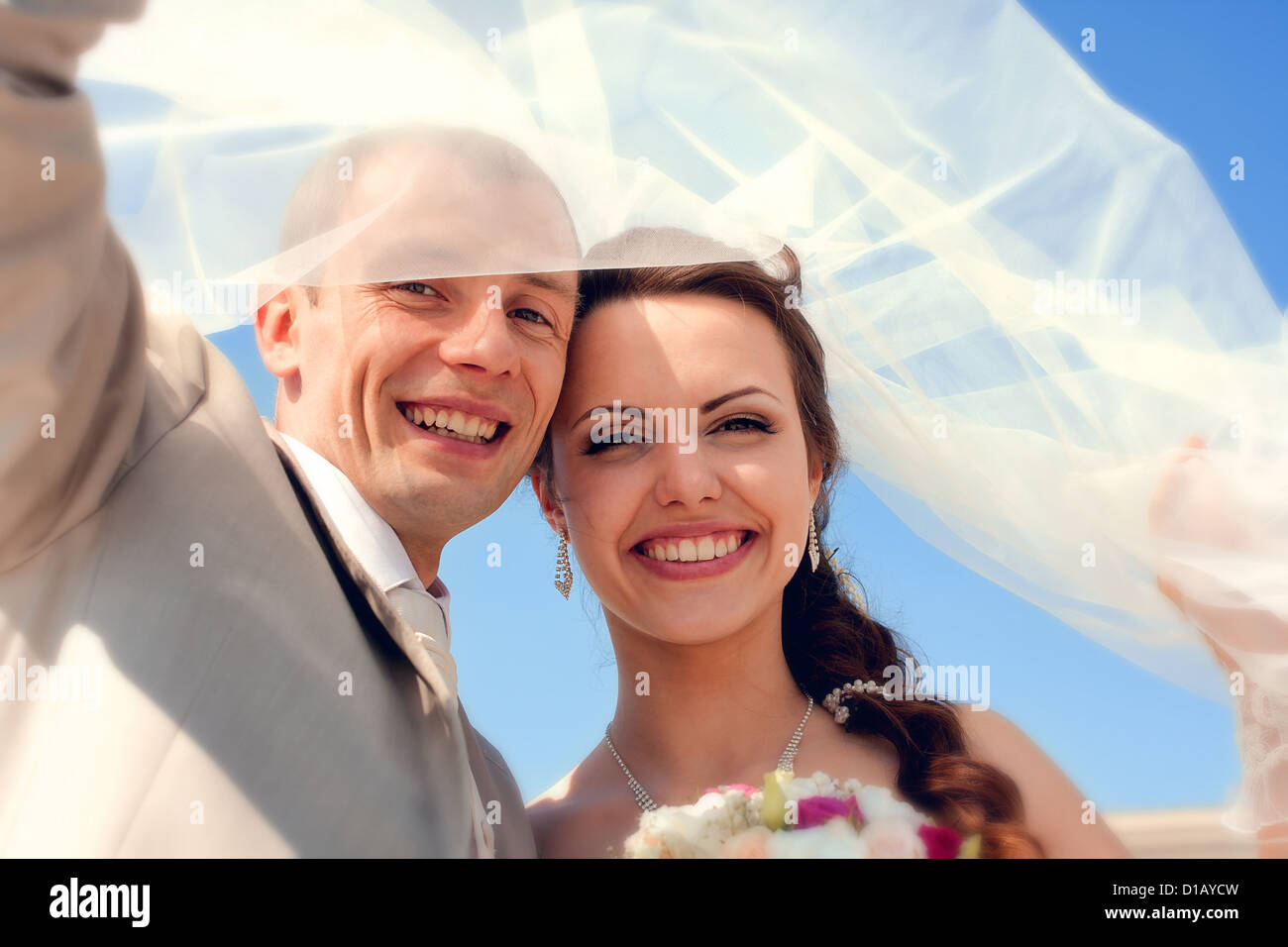 Young Smiling bride and groom close-up Stock Photo - Alamy