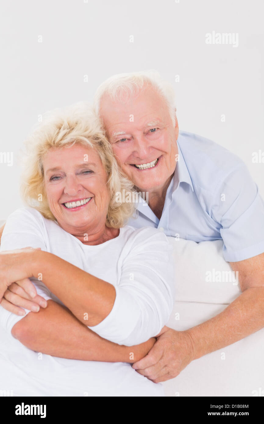 Smiling old couple hugging Stock Photo - Alamy