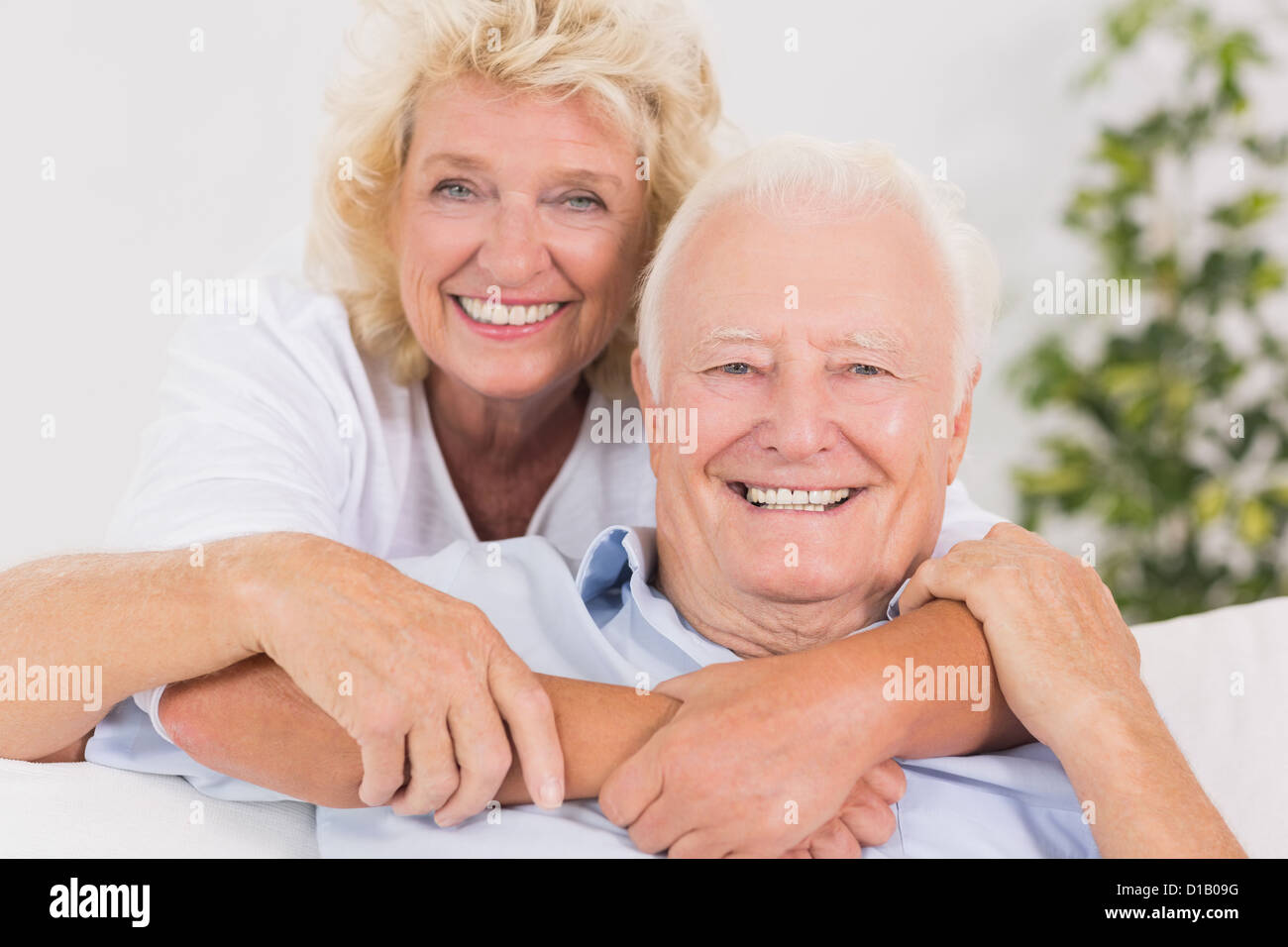 Happy old couple portrait hugging Stock Photo - Alamy