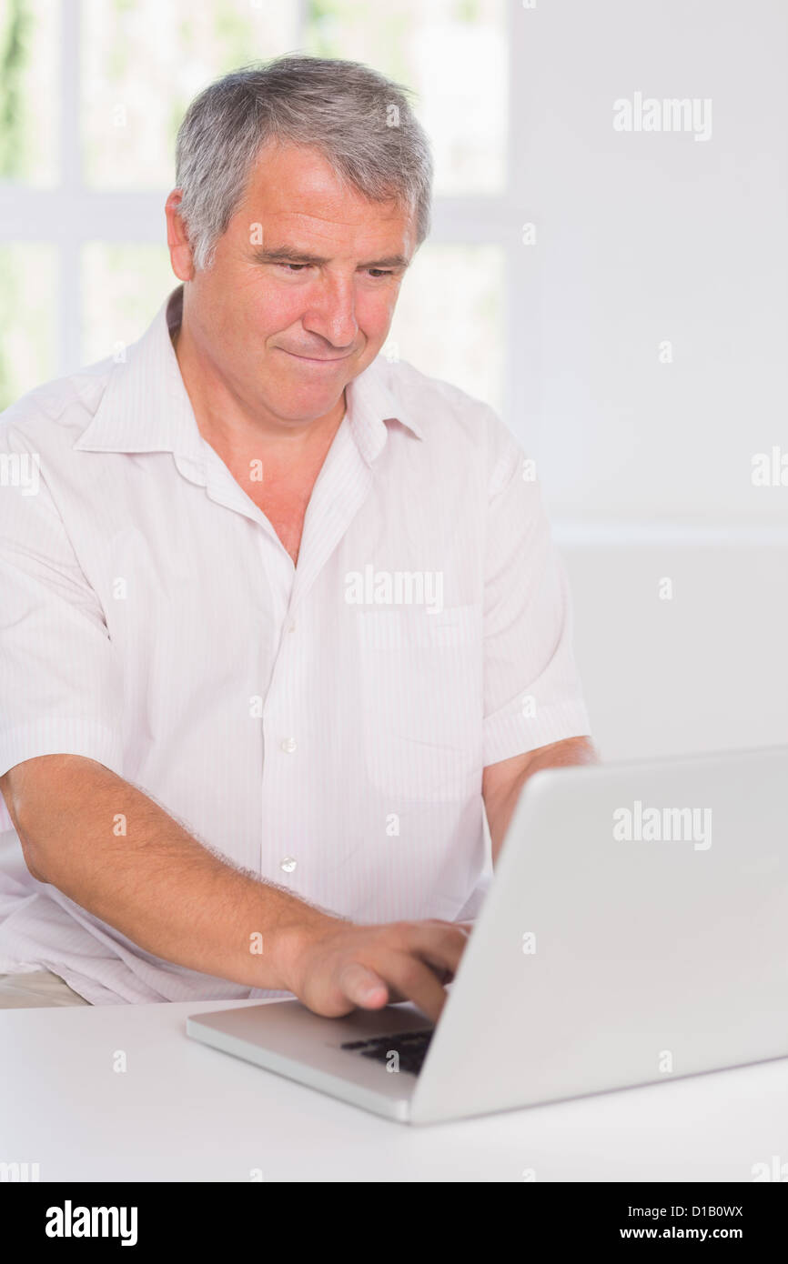 Old man concentrating in front of his laptop Stock Photo - Alamy