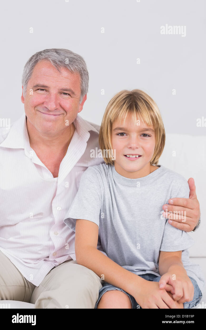Portrait of a little boy and his grandfather smiling Stock Photo - Alamy