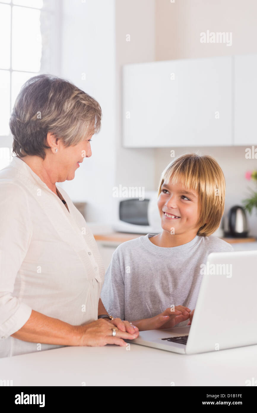 Granny and grandson using laptop Stock Photo - Alamy