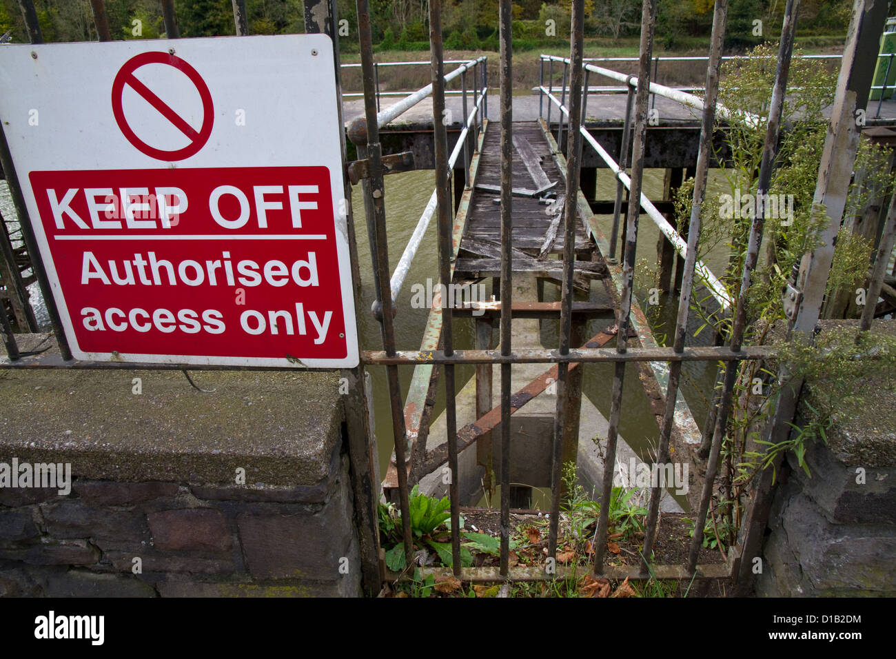 A sign saying Keep Off Authorised Access Only prohibits entry to a ...