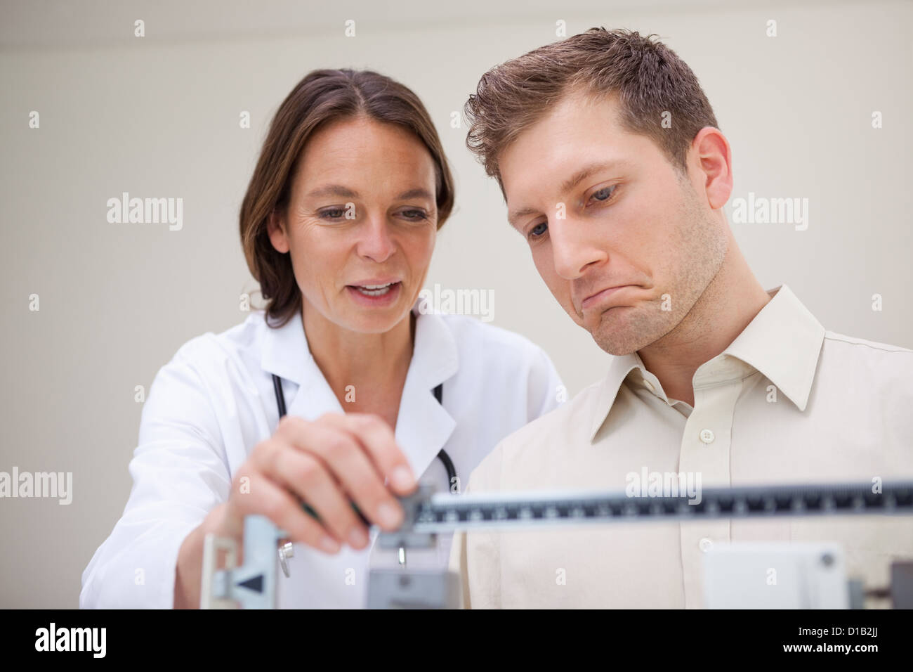 Doctor weight scale hi-res stock photography and images - Alamy