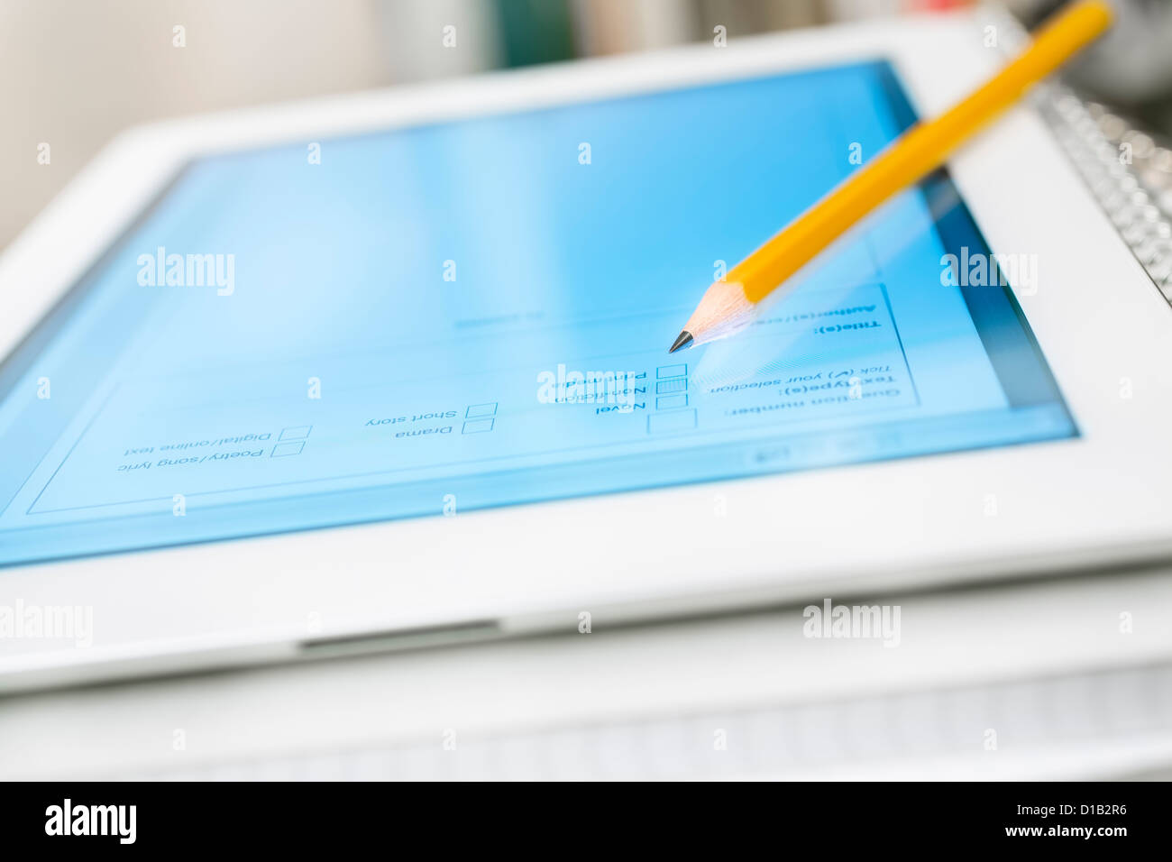 Digital tablet on stack of notebooks and textbooks Stock Photo - Alamy