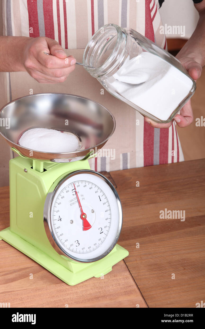 Weighing sugar on scales hi-res stock photography and images - Alamy