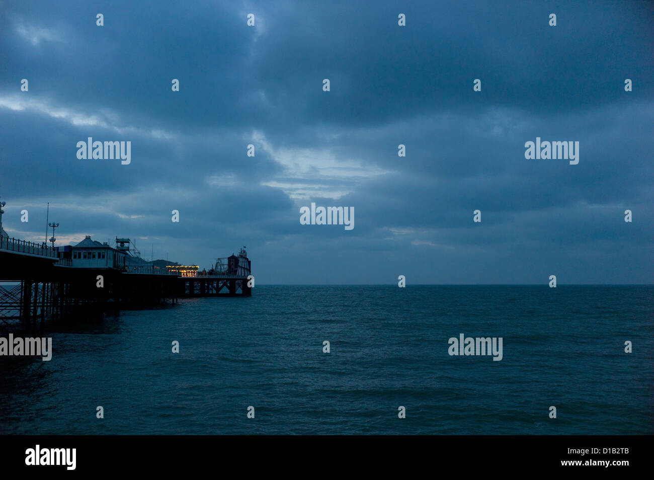 Brighton Palace Pier, early morning, dark, roundabout illuminated Stock ...