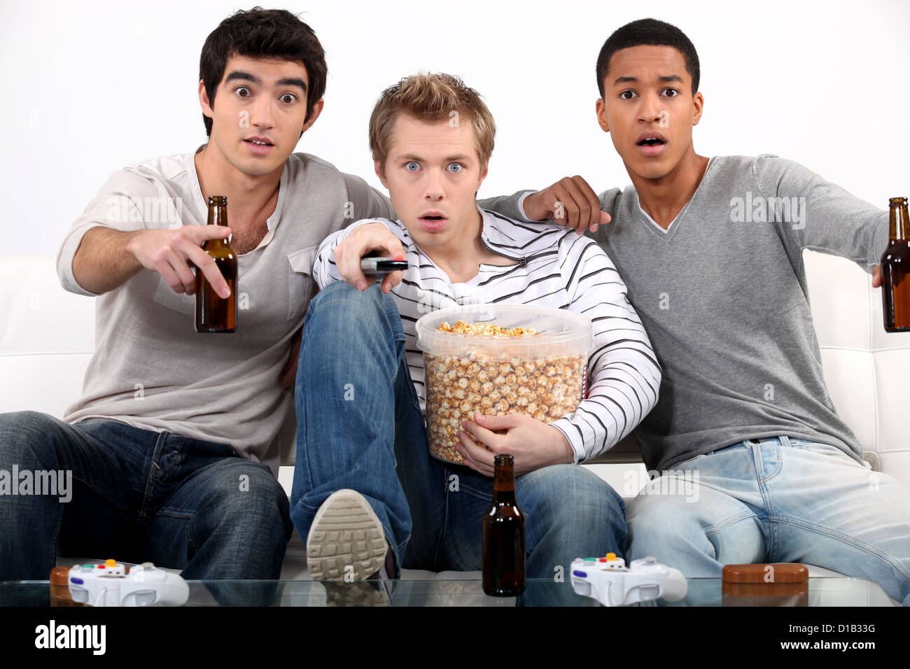 Men watching a horror movie Stock Photo - Alamy