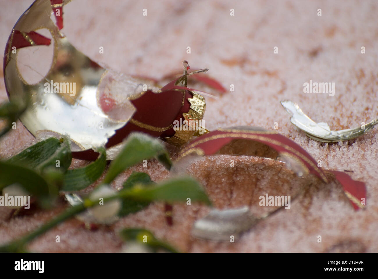 Smashed Christmas baubles with mistletoe Stock Photo - Alamy