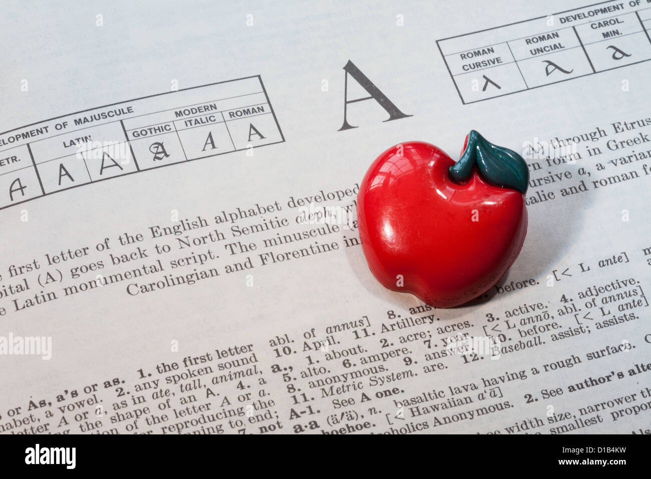 The Letter A In the Dictionary with Apple, Still Life Stock Photo - Alamy