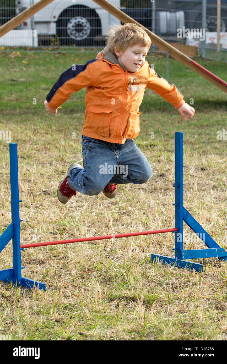 Child kid crossbar jumping hi-res stock photography and images - Alamy