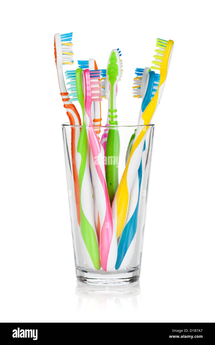 Colorful toothbrushes in glass. Isolated on white background Stock ...
