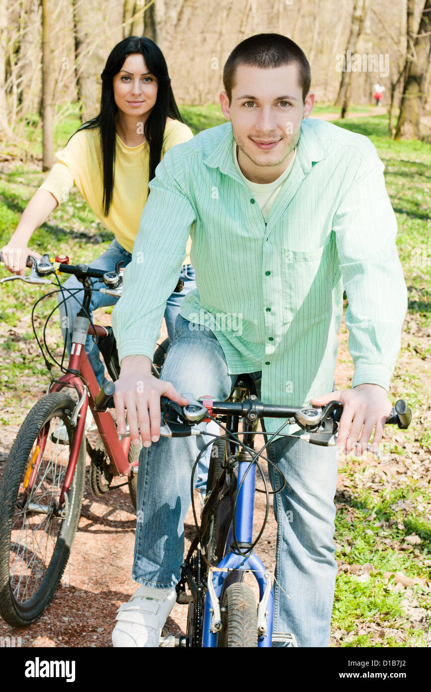 Couple on bike relaxing outdoors Stock Photo - Alamy