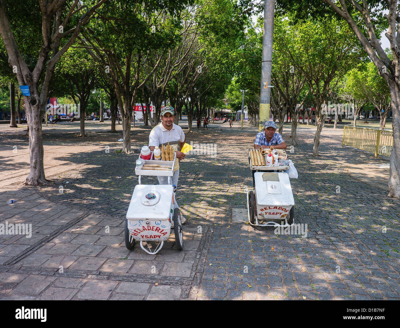 Two helado vendors push their carts selling ice cream outside the ...