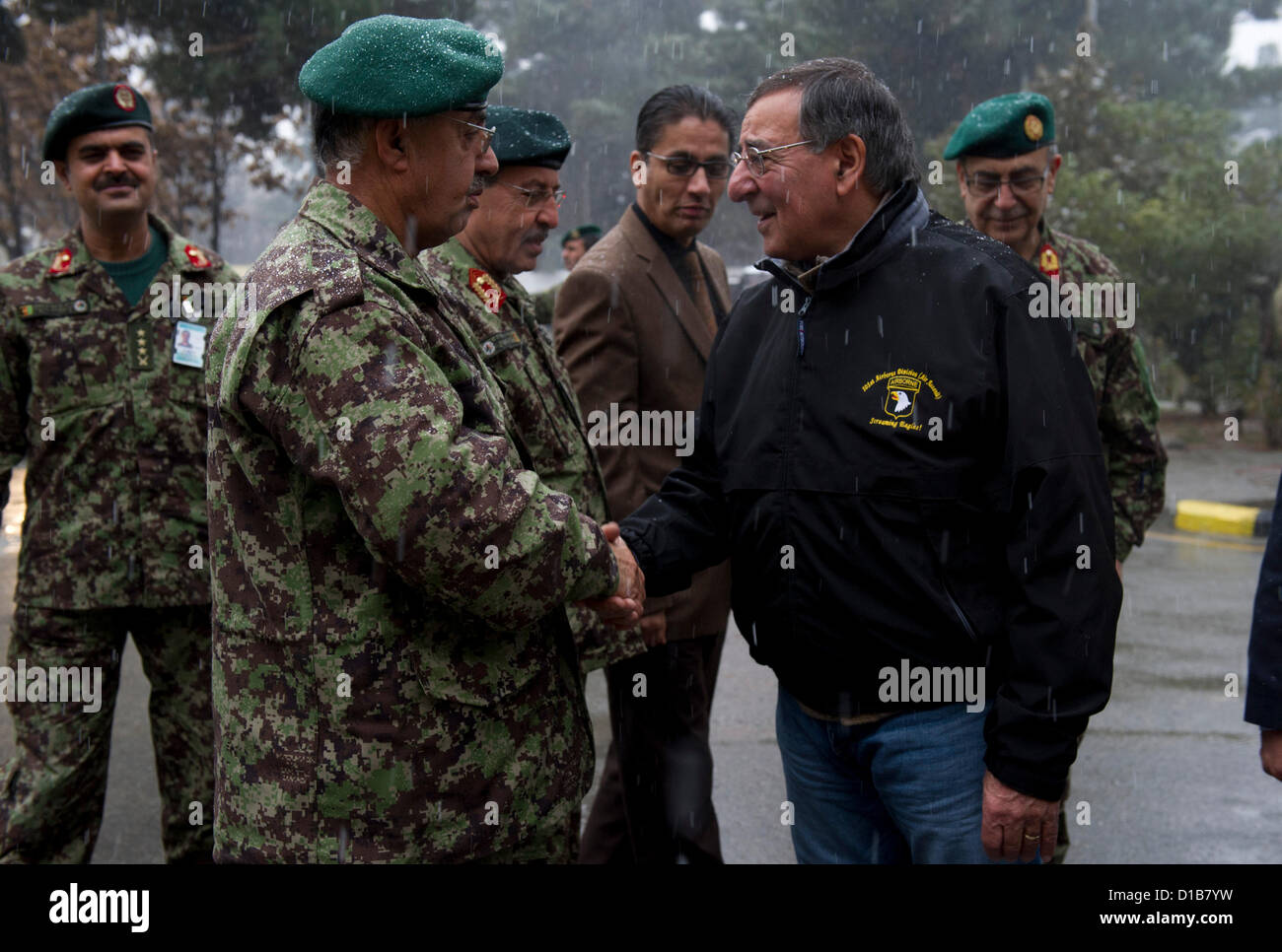 US Defense Secretary Leon Panetta shakes hands with Afghan Army members ...