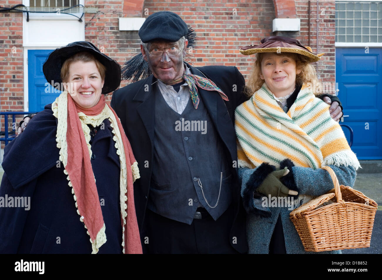 two smartly dressed women in period dress with traditional chimney ...